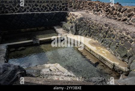 Traditional bathing pool along the Jeju Olle Trail in rural Jeju Island ...