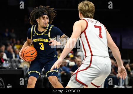 Michigan guard Tre Donaldson dribbles during the second half of an NCAA ...