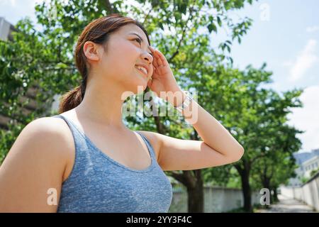 Young woman sweating outdoors Stock Photo - Alamy