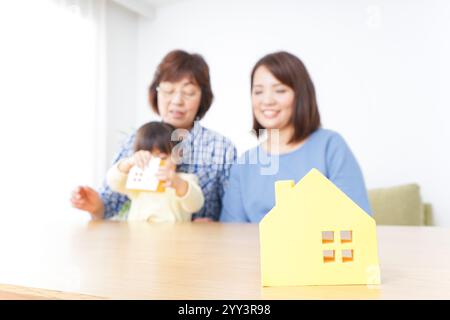 Family members examining real estate Stock Photo - Alamy