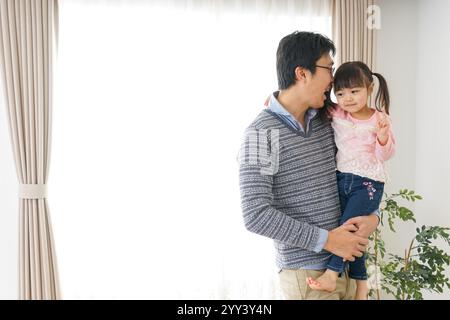 Fathers raising children Stock Photo - Alamy