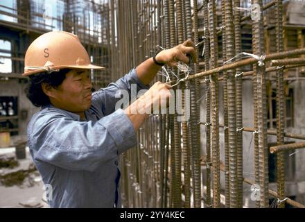 Singapore building site on reclaimed land. Construction workers. Circa ...