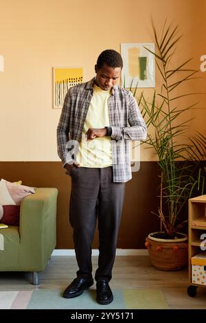Young employee in time management concept in the office Stock Photo - Alamy
