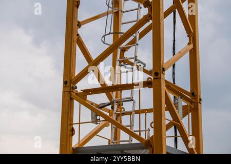 Closeup view of yellow Crane Access Ladder, steel staircase ...