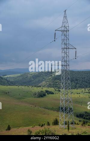 High voltage towers in the mountain at sunset in Spain Stock Photo - Alamy
