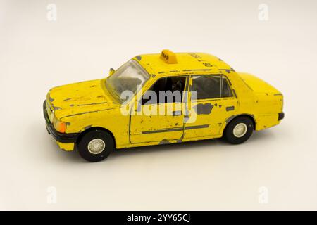 A closeup of a taxi car toy on a white background Stock Photo - Alamy