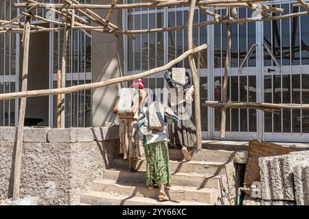Old women carrying large stones to build a new Building, Addis Ababa ...