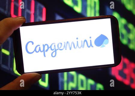 In this photo illustration, the Capgemini logo seen displayed on a ...