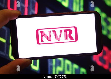 In this photo illustration, the NVR company logo is seen displayed on a ...