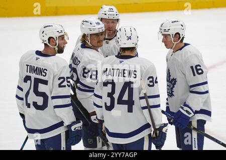 Toronto Maple Leafs Mitch Marner plays with his dog Zeus on the ice ...