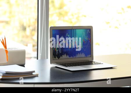 Currency traders work near a screen showing the Korea Composite Stock ...