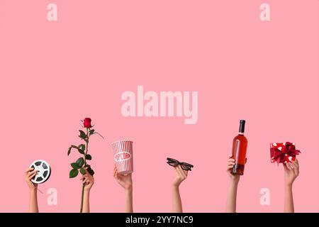 Female hands with film reel, rose flower, bucket of popcorn and 3D ...