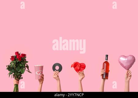 Female hands with film reel, rose flower, bucket of popcorn and 3D ...