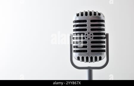 Detail of a vintage style metal condenser microphone with stand on a ...
