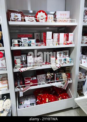 Festive wrapped gifts including a red Merry Christmas box stacked on ...