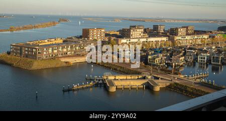 Overlook of floating residence and buildings in Amsterdam at sunset ...