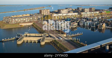 Overlook of floating residence and buildings in Amsterdam at sunset ...