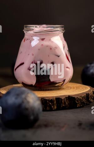 plum and plum-flavored yogurt, plum yogurt with slices and whole fruits ...