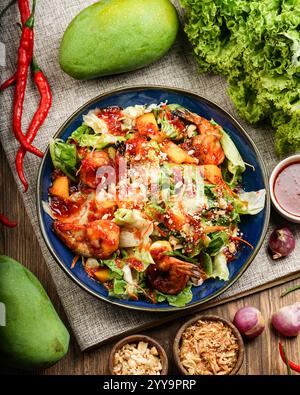 spicy mango salad , asian style food Stock Photo - Alamy