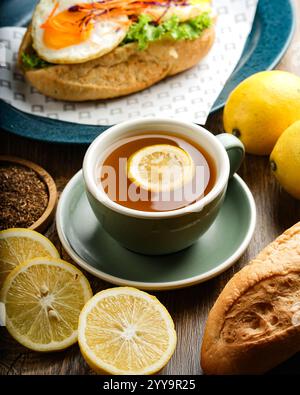 Cup of fresh lemons on light background Stock Photo - Alamy