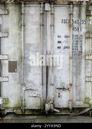 Old weathered metal double doors with heavy rust and peeling paint set ...