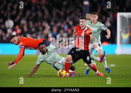 Derby County's Carlton Morris (centre, top) celebrates scoring their ...