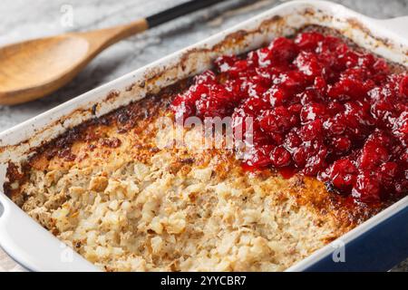 Baking dish with tasty rice casserole on light background Stock Photo ...