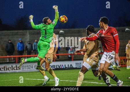 Morecambe FC's Marcus Dackers tries a head shot towards goal during the ...