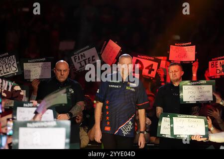 Nick Kenny walks out to play Raymond van Barneveld (not pictured) in ...