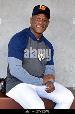 FILE - Oakland Athletics' Rickey Henderson, left, goes sliding into ...