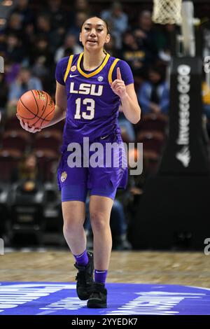 LSU guard Last-Tear Poa (13) controls the ball while pressured by UCLA ...
