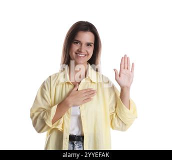 Woman making promise with raised hand on orange background. Oath ...
