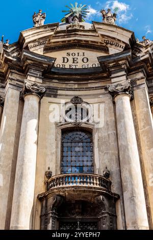 A large building with a clock on the front. The clock is set at 10:00 ...