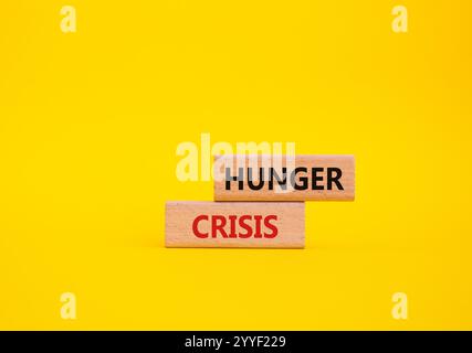 Hunger Crisis symbol. Wooden blocks with words Hunger Crisis. Beautiful ...