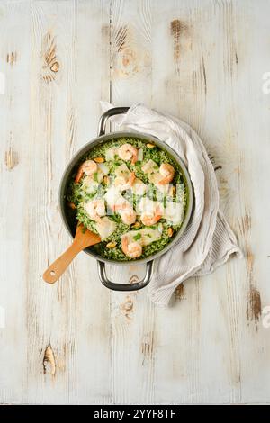 Overhead view of rice risotto with seafood shrimps mussels italian food ...