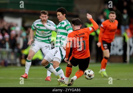 Celtic's Yang Hyun-Jun (centre) is fouled by Ross County's James Brown ...