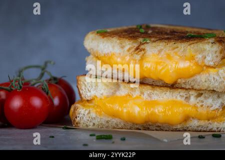 Grilled Cheese with melting cheese dripping from the inside. The ...