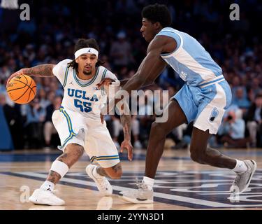 UCLA guard Skyy Clark (55) dribbles against Michigan State guard Jase ...