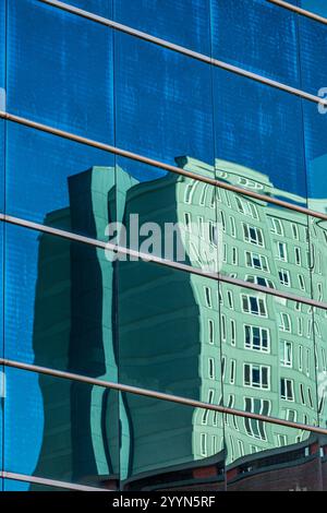 Condo building reflected in windows of other buildings in Seattle ...