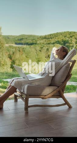 Female programmer relaxing in office at night Stock Photo - Alamy