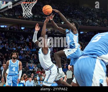 UCLA guard Eric Dailey Jr. reaches for the ball during an NCAA college ...