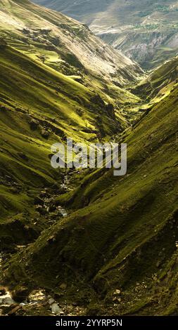 An epic view of a huge mountain rift, the terrain is covered with ...