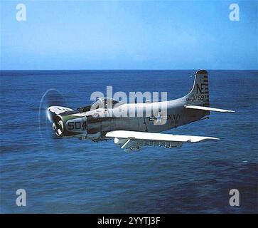 Douglas AD-2 Skyraider of VA-65 taxies forward on the flight deck of ...