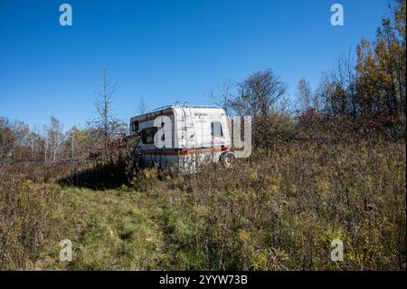 Old RV abandoned in field Stock Photo - Alamy