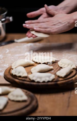 Process of cooking home-made dumplings, ravioli or pelmeni with minced ...
