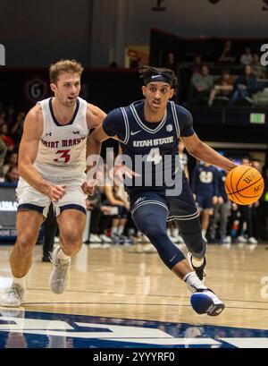 Utah State guard Ian Martinez (4) brings the ball up court during the ...