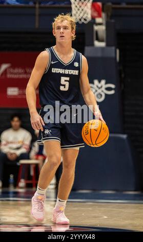 Utah State guard Ian Martinez (4) is fouled by San Diego State forward ...