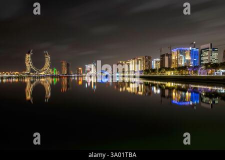 Stunning night view of Lusail skyline with Crescent tower Lusail Marina ...