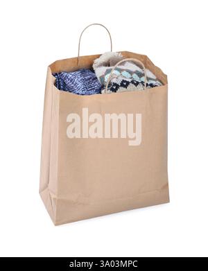 Used clothes in paper bag isolated on white Stock Photo - Alamy