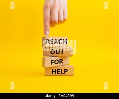 Reach out for help symbol. Wooden blocks with words Reach out for help ...